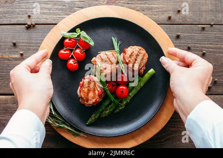 food stylist decor pork grilled pork medallions Stock Photo - Alamy