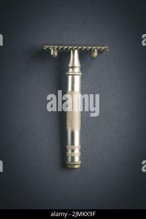 Old vintage shaver on a black background Stock Photo - Alamy