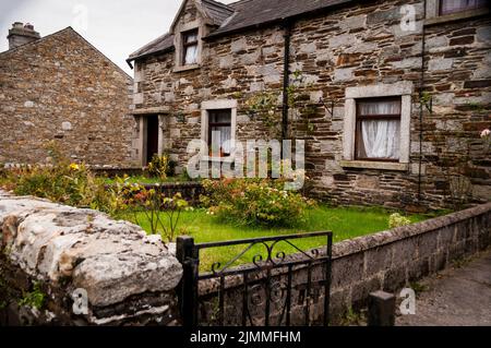 Terraced cottages with stone door pediments in Hacketstown in County ...