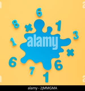Colourful math numbers blue stain top view Stock Photo - Alamy