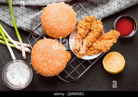 Top view fried chicken burgers with fries green onion. Resolution and ...