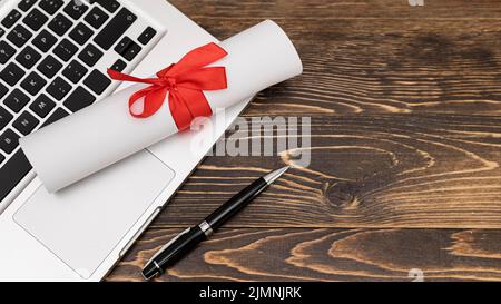 Graduation diploma certificate with ribbon bow Stock Photo - Alamy