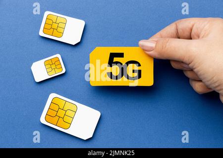 Top view hand holding 5g sim card Stock Photo - Alamy