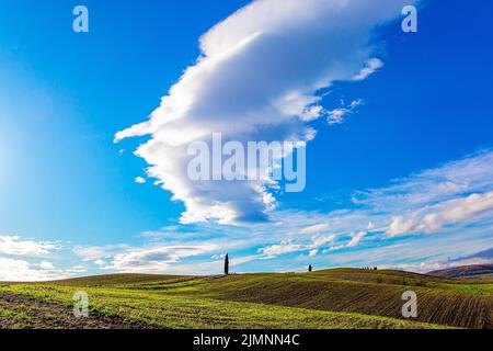 Bizarre clouds lit by the sunset Stock Photo - Alamy