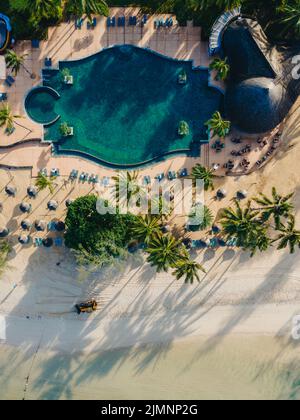Drone aerial view of relax woman in dress lying on flower blooming ...