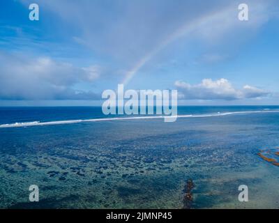 Drone aerial view of ocean with rainbow, rainbow in ocean Mauritius ...