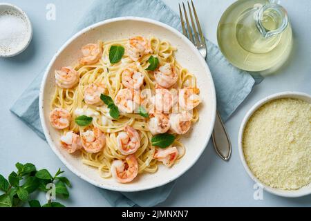 Pasta bavette with fried shrimps, bechamel sauce, mint leaf, garlic ...