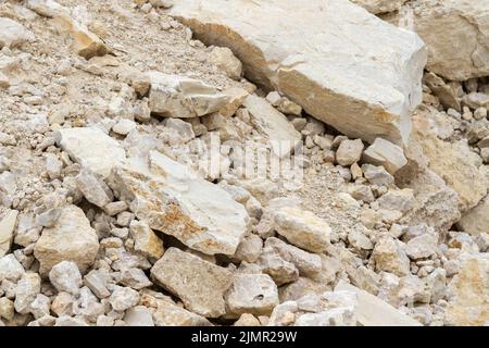 Ruins in a quarry. Dumps of clay and crushed stone in a quarry ...
