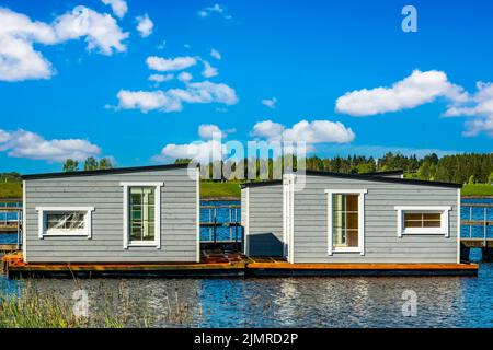 Floating fishing cabins on the lake water Stock Photo - Alamy
