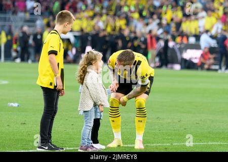 Marco Reus with children after the game on the pitch, soccer 1st ...