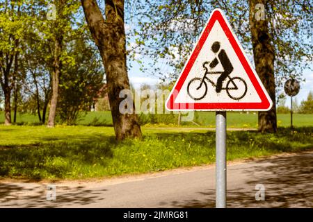 Warning symbol in a red triangle. Bicycle traffic sign.Cycle route ...