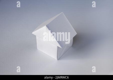 Paper house origami isolated on a white background Stock Photo - Alamy