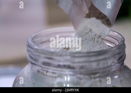 some pour the flour into a glass jar for safe storage. Protection ...
