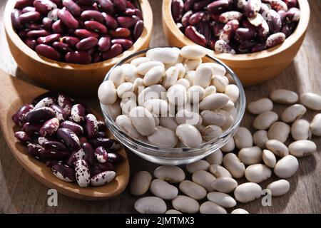 Composition with dried beans on the table Stock Photo - Alamy