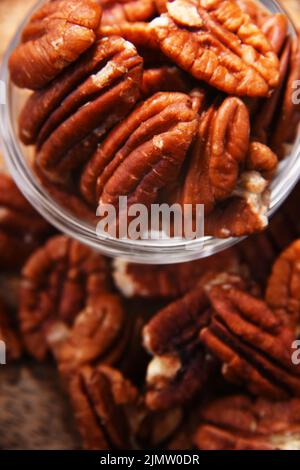 Composition with a bowl of shelled pecan nuts. Delicacies Stock Photo ...