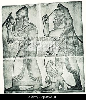 The 1910 caption reads: "Assyrian king between genie - in the Royal ...