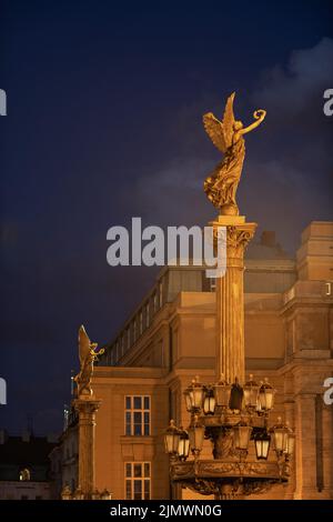 statue near Rudolfinum concert hall at night in Prague, Czech Republic ...