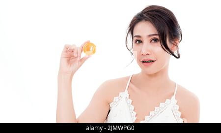 Beautiful woman with organic shampoo over light yellow background Stock ...