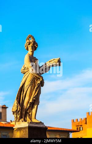 historic statue at the Trinita bridge in Florence, Italy Stock Photo ...