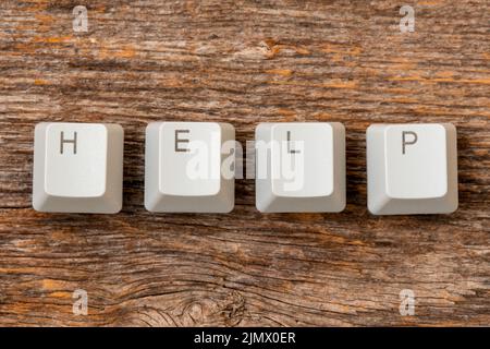 Four computer keyboard keys arranged to spell HELP word Stock Photo - Alamy