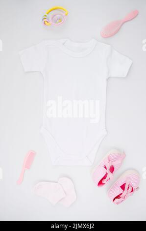 Flat lay baby clothes with white background Stock Photo - Alamy