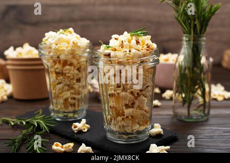 Glasses with popcorn on slate tray on kitchen table Stock Photo - Alamy