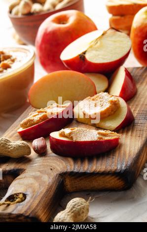 Board of fresh apples with nut butter on color wooden table Stock Photo ...