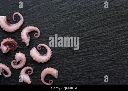 Top view small pieces octopus Stock Photo - Alamy