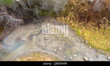 Aerial view of curving the shallow river bank. View from air. Turns of ...