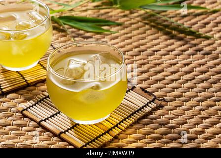 Cold Japanese green tea placed on a straw ranchon mat Stock Photo - Alamy