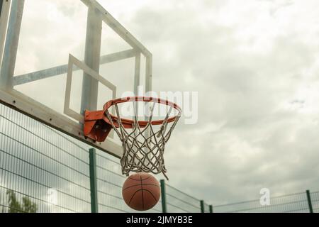 Throwing ball into basket. Accurate hit. Basketball Stock Photo - Alamy