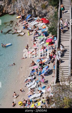 Tourists enjoy Sablicevo beach during high temperatures in Rijeka ...