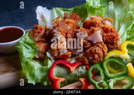 Crispy fish Popcorn with honey mustard sauce on wooden background Stock ...