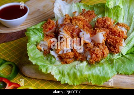 Crispy fish Popcorn with honey mustard sauce on wooden background Stock ...