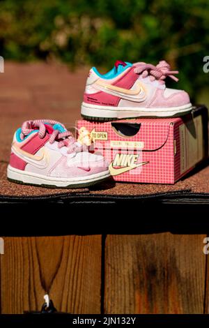 A close-up shot of sneakers with decorations: product display ...