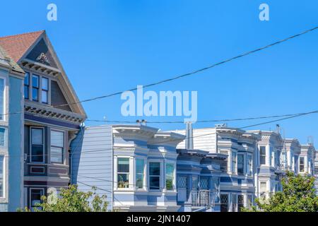 Bay windows of an adjacent houses with wood shingle sidings at San ...
