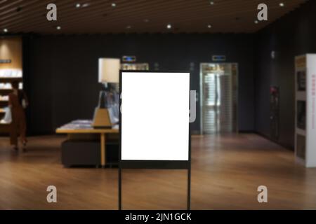 Advertising poster board inside department store Stock Photo - Alamy