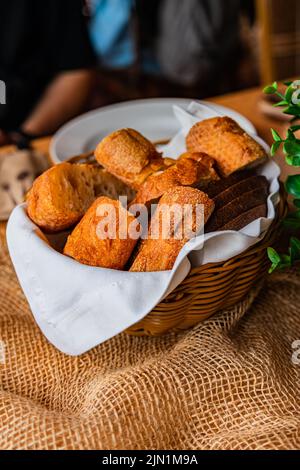 Tasty bread on table on brown background Stock Photo - Alamy