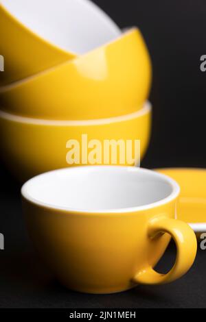 bright ceramics - bowl and cups in yellow, blue, red and pink colors on ...