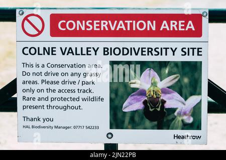 Colne Valley Biodiversity Site conservation area sign on gate. Green ...