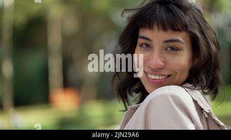 A hispanic woman with indigenous traits smiling at camera. Portrait ...