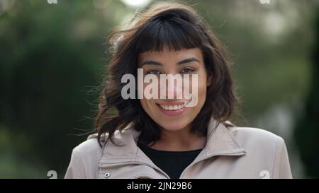 A hispanic woman with indigenous traits smiling at camera. Portrait ...