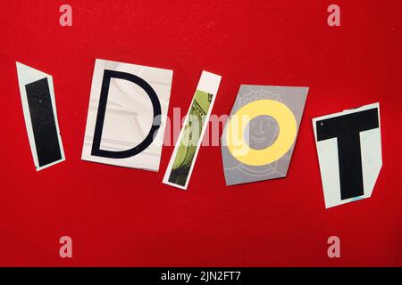 The word "idiot" using cut-out paper letters in the ransom note effect ...