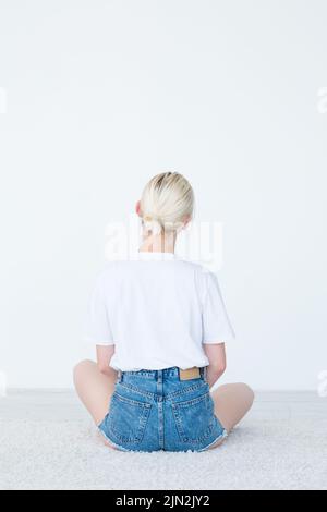 backview woman looking invisible object white Stock Photo - Alamy
