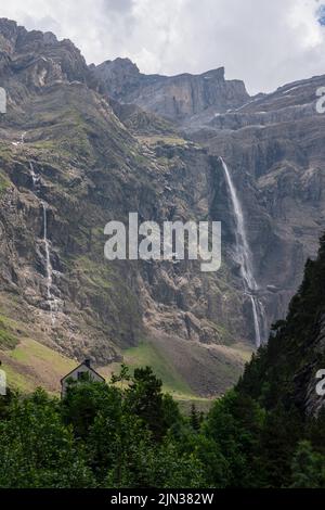 large waterfalls on steep mountain cliffs, Cirque de Gavarnie, Pyrenees ...
