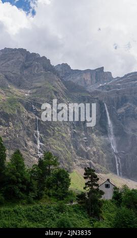 large waterfalls on steep mountain cliffs, Cirque de Gavarnie, Pyrenees ...
