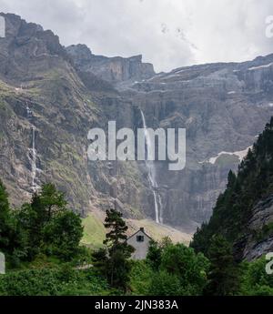 large waterfalls on steep mountain cliffs, Cirque de Gavarnie, Pyrenees ...