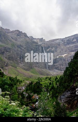 large waterfalls on steep mountain cliffs, Cirque de Gavarnie, Pyrenees ...