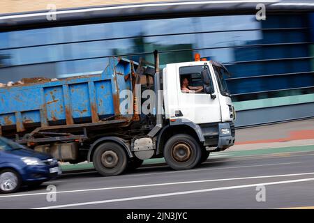 A roll on roll off rubble skip lorry seen driving throug hLeeds City ...