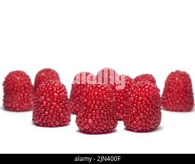 Red chewing sweets in the form of berries isolated on white background ...